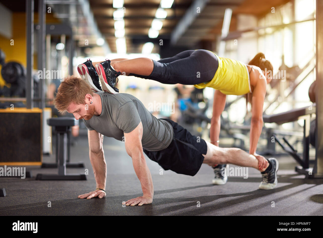 Trained couple in good condition in gym Stock Photo - Alamy