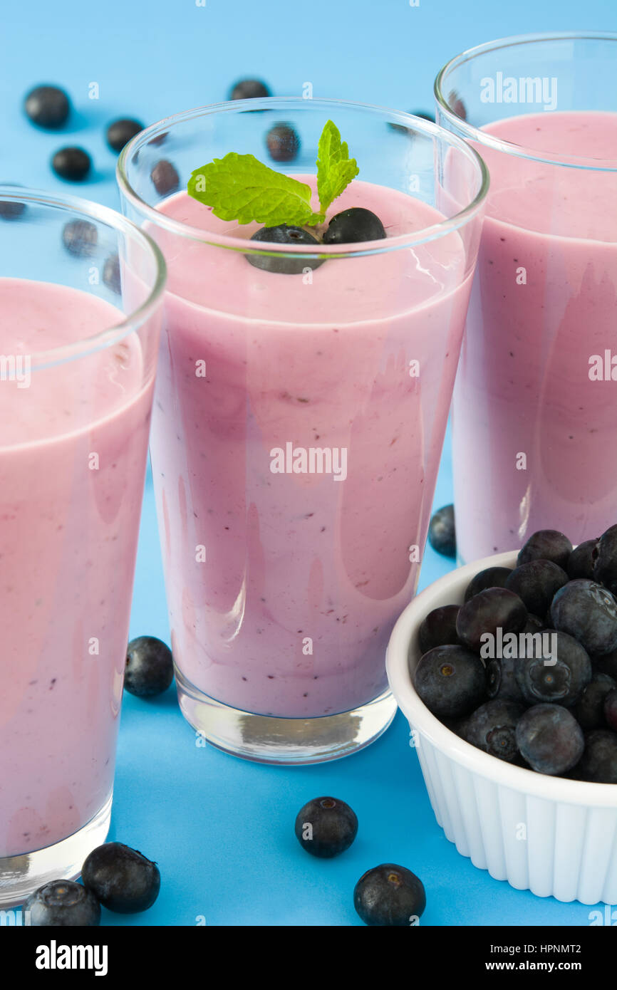 Fresh blueberry smoothie with blue background Stock Photo - Alamy