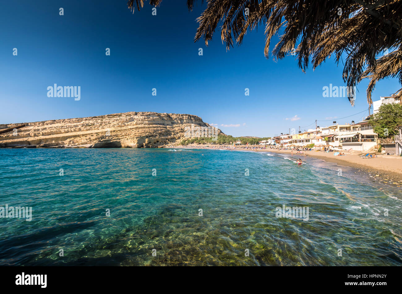 Matala beach on Crete island, Greece. View from the rocks. There are ...