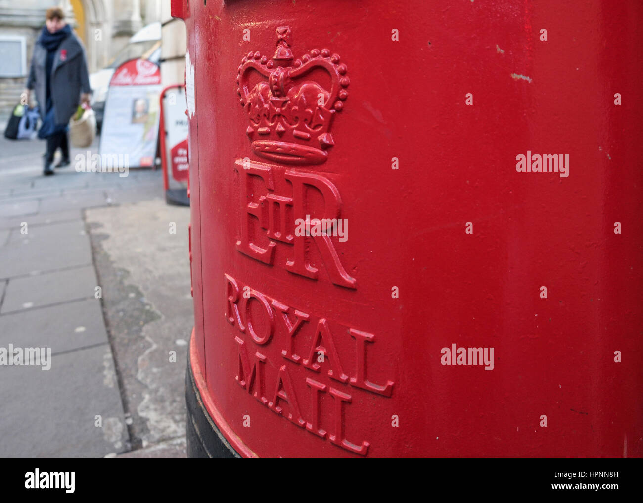 A red Royal Mail post box is pictured outside a post office in Bath ...