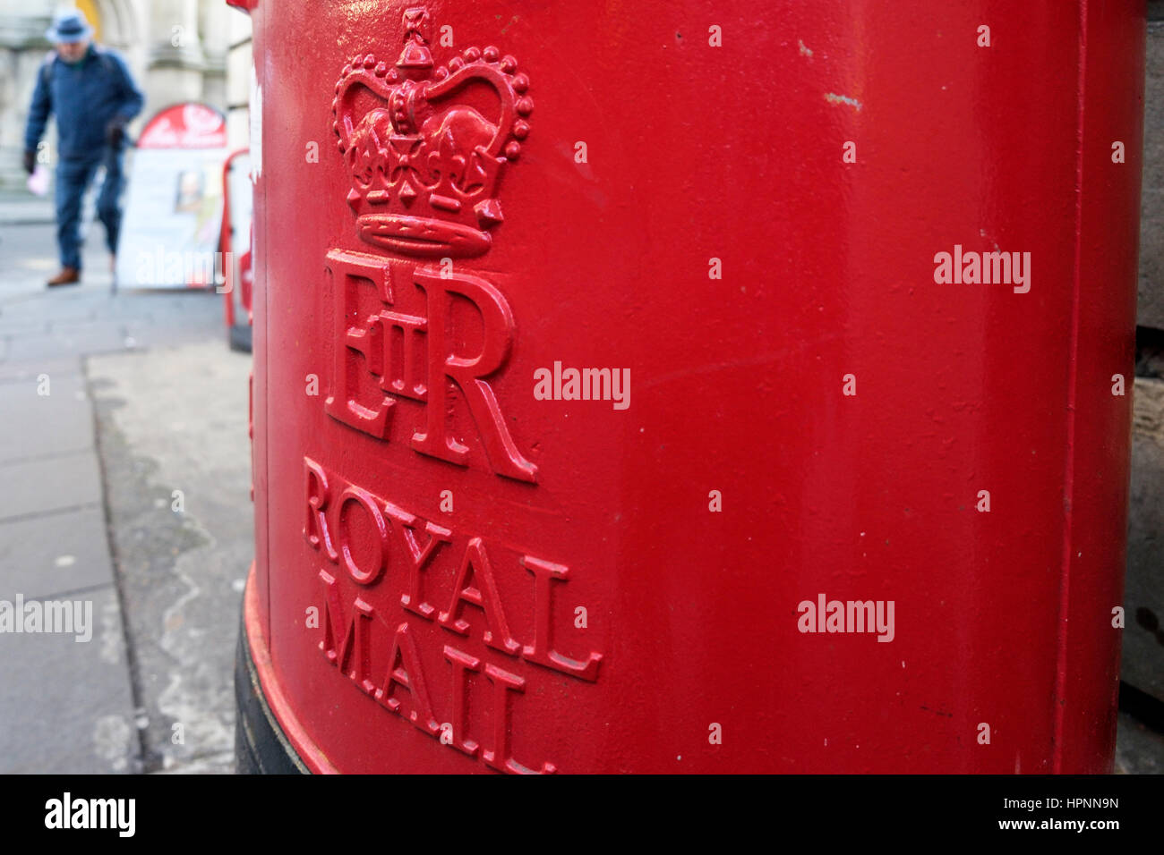 A red Royal Mail post box is pictured outside a post office in Bath ...