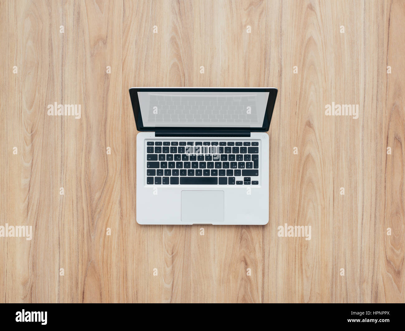 Professional contemporary design laptop on a wooden desktop, top view ...