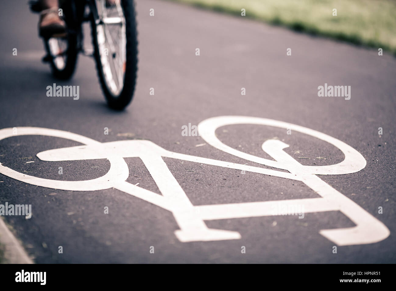 City bike path with bicycle sign details, commute on bike in urban ...