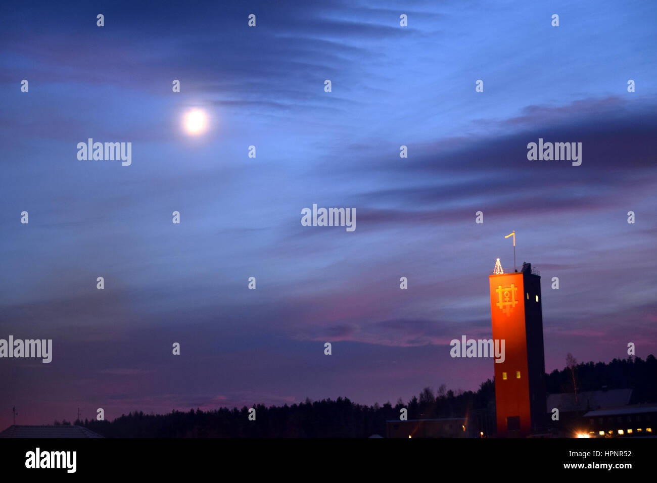 A christmas tree on the tower in the moonshine Stock Photo - Alamy