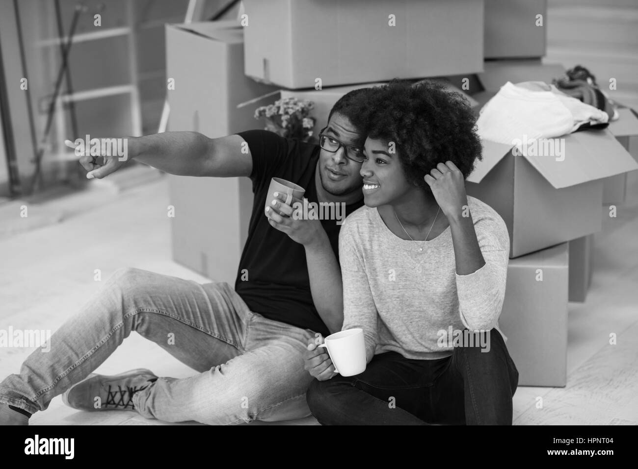 Relaxing In New House Cheerful Young African American Couple Sitting