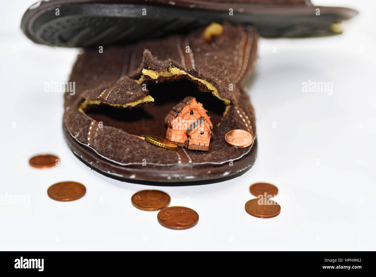 Leaky brown slippers. Abstract composition of poverty. Isolated on ...