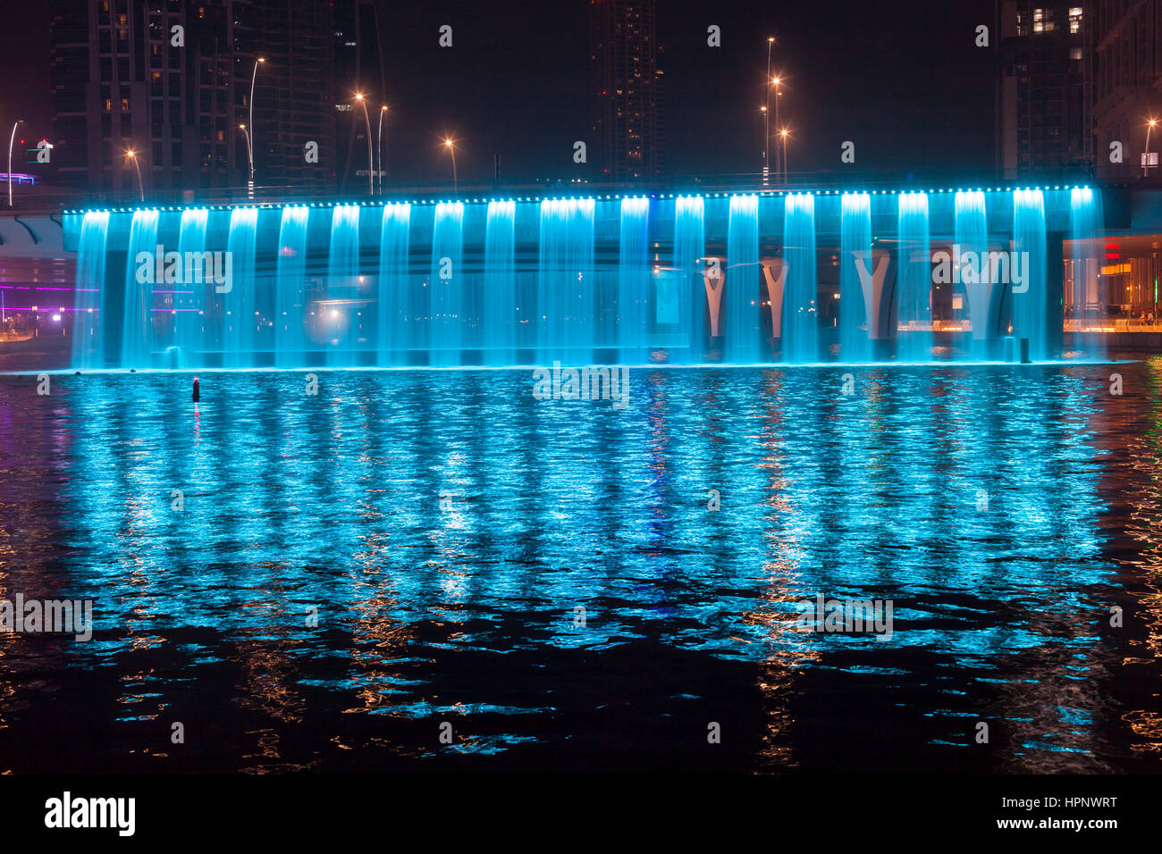 Blue illuminated Waterfall at the Sheikh Zayed Bridge, part of the ...
