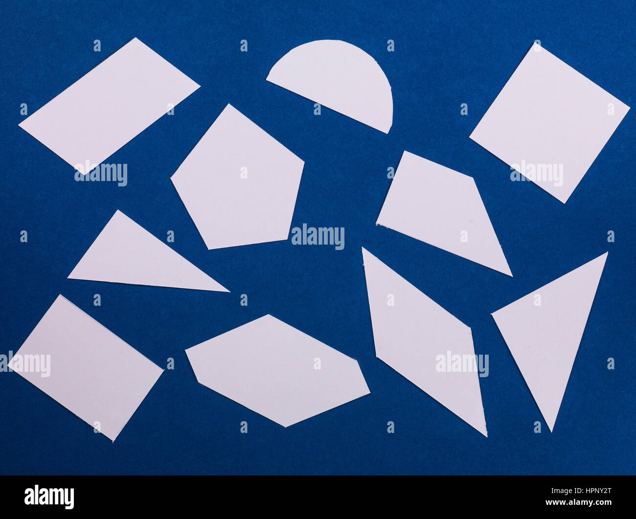 Random Pattern of Geometric Shapes on a Blue Background Stock Photo - Alamy