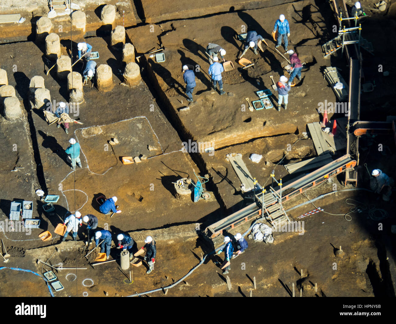 Aerial view of construction workmen at a building site in Tokyo Japan ...
