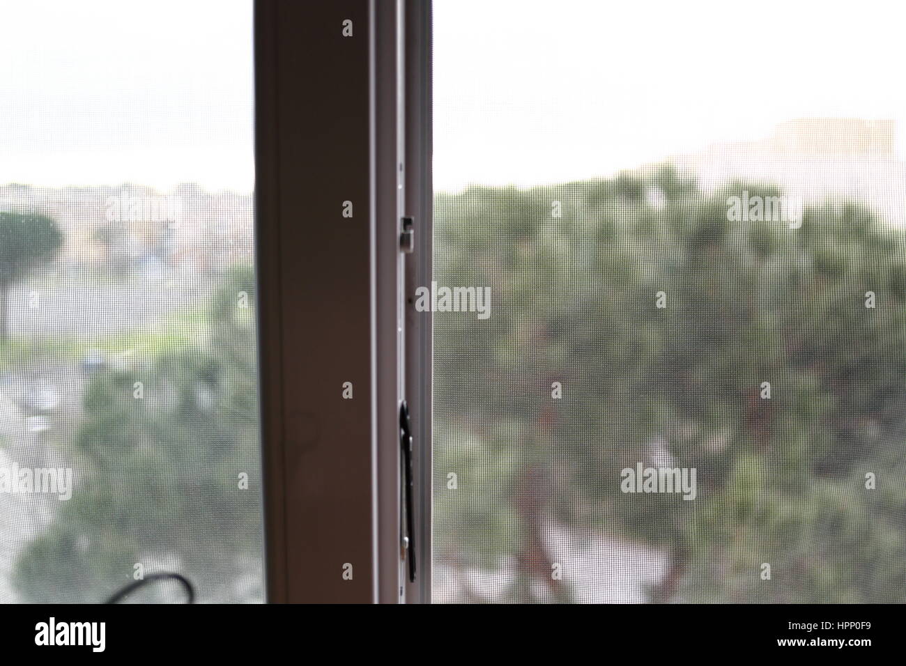 Mosquito net on a PVC window Stock Photo - Alamy