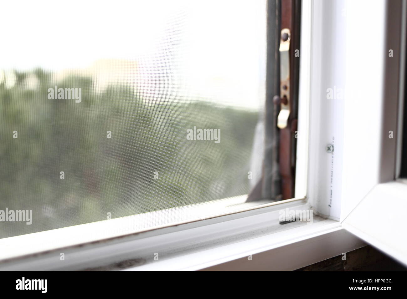 Mosquito net on a PVC window Stock Photo - Alamy