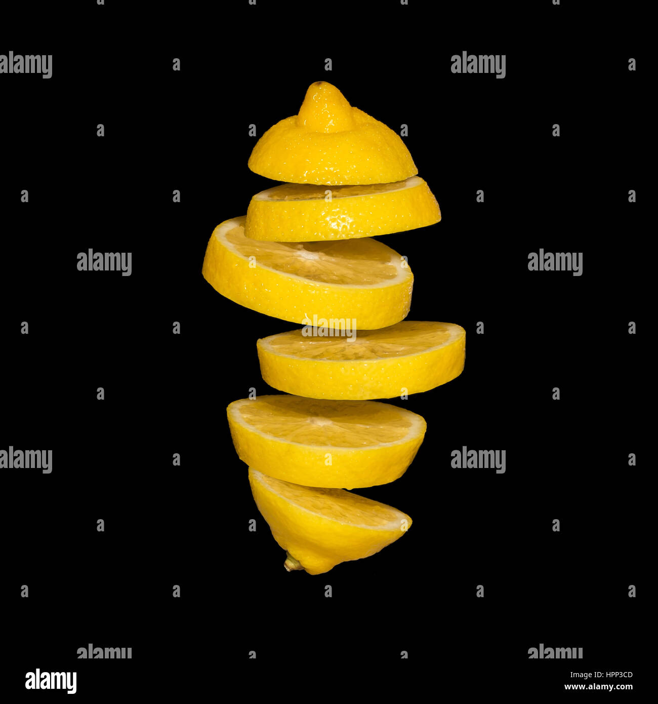 Flying lemon. Sliced lemon isolated on black background. Levity fruit ...