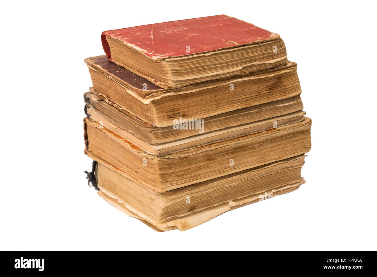 A stack of old tattered books. Vintage torn books. Antiques isolated ...