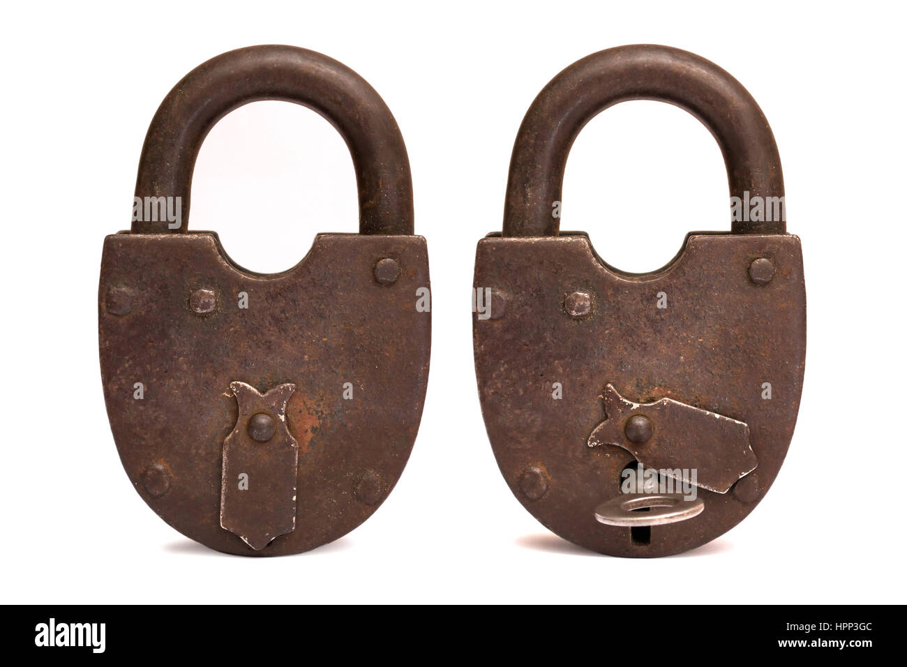 Old rusty padlock isolated on white background, key in the lock Stock ...