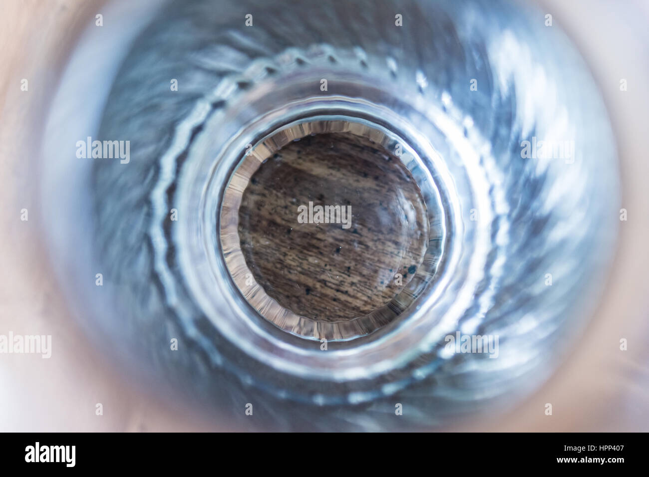 Abstract view inside vase with water on wooden table Stock Photo - Alamy
