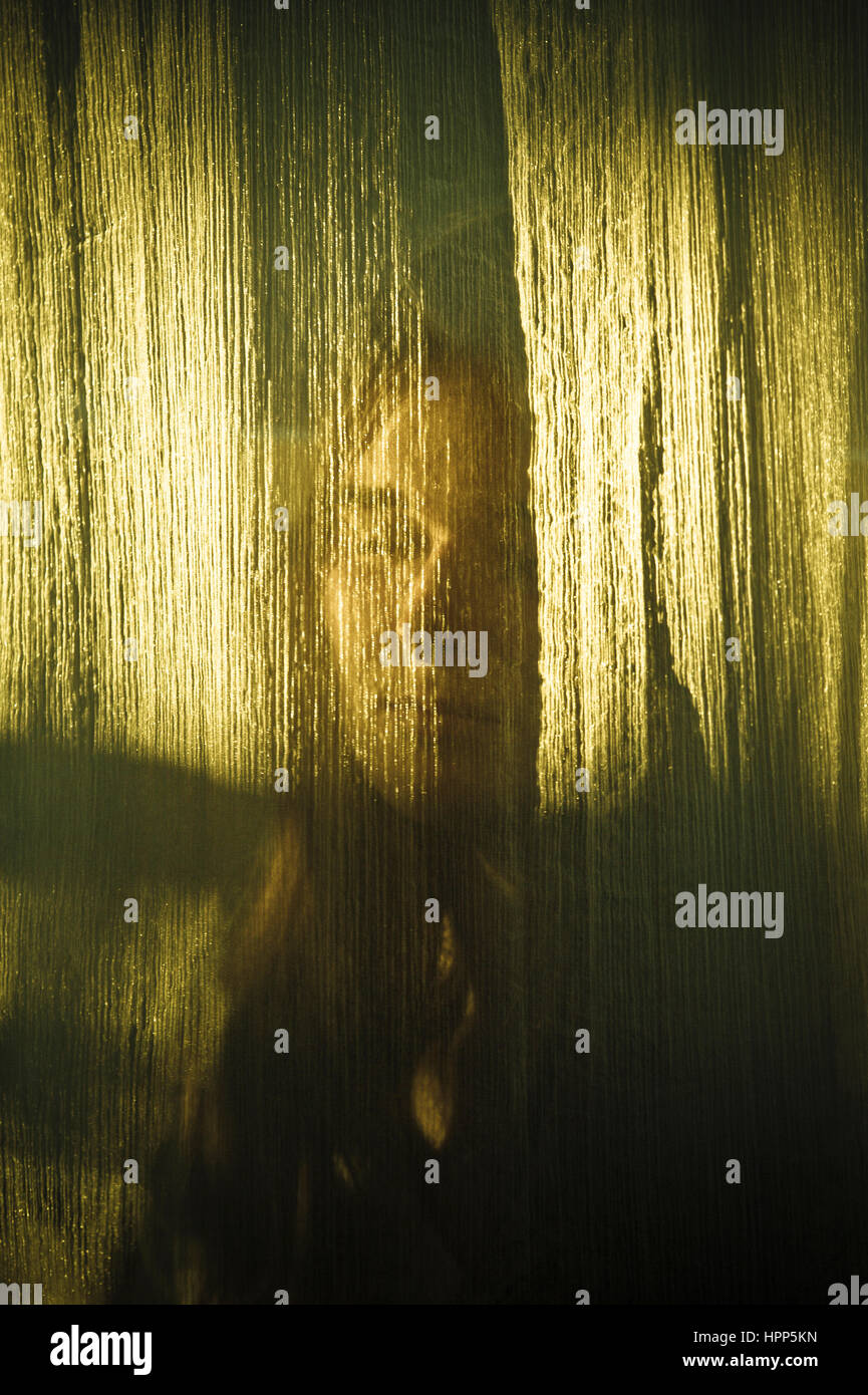Young girl obscured dark hi-res stock photography and images - Alamy