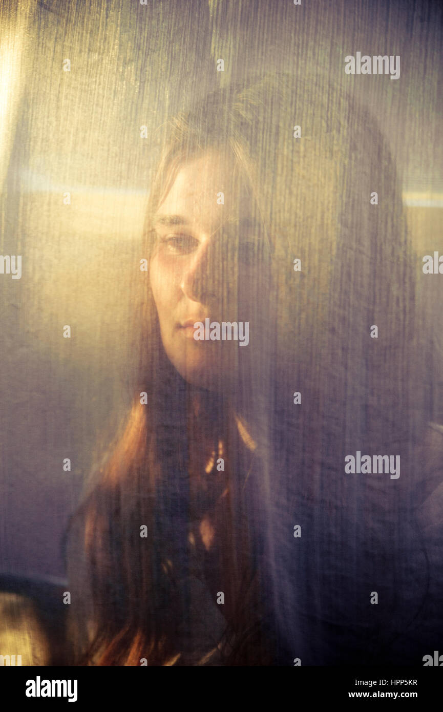 young woman with face obscured by a cloth Stock Photo - Alamy