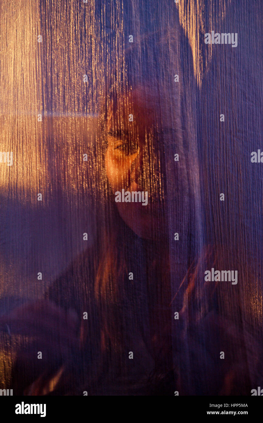young woman with face obscured by a cloth Stock Photo - Alamy