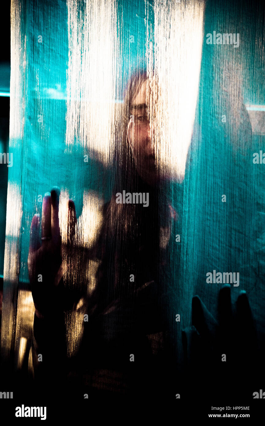 young woman with face obscured by a cloth Stock Photo - Alamy