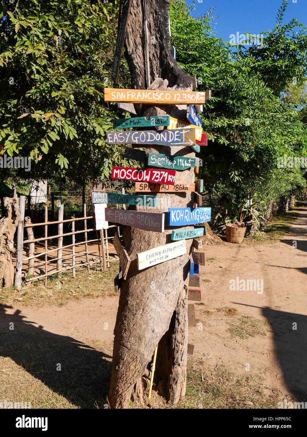 Signpost with wooden signs in many colors Stock Photo - Alamy