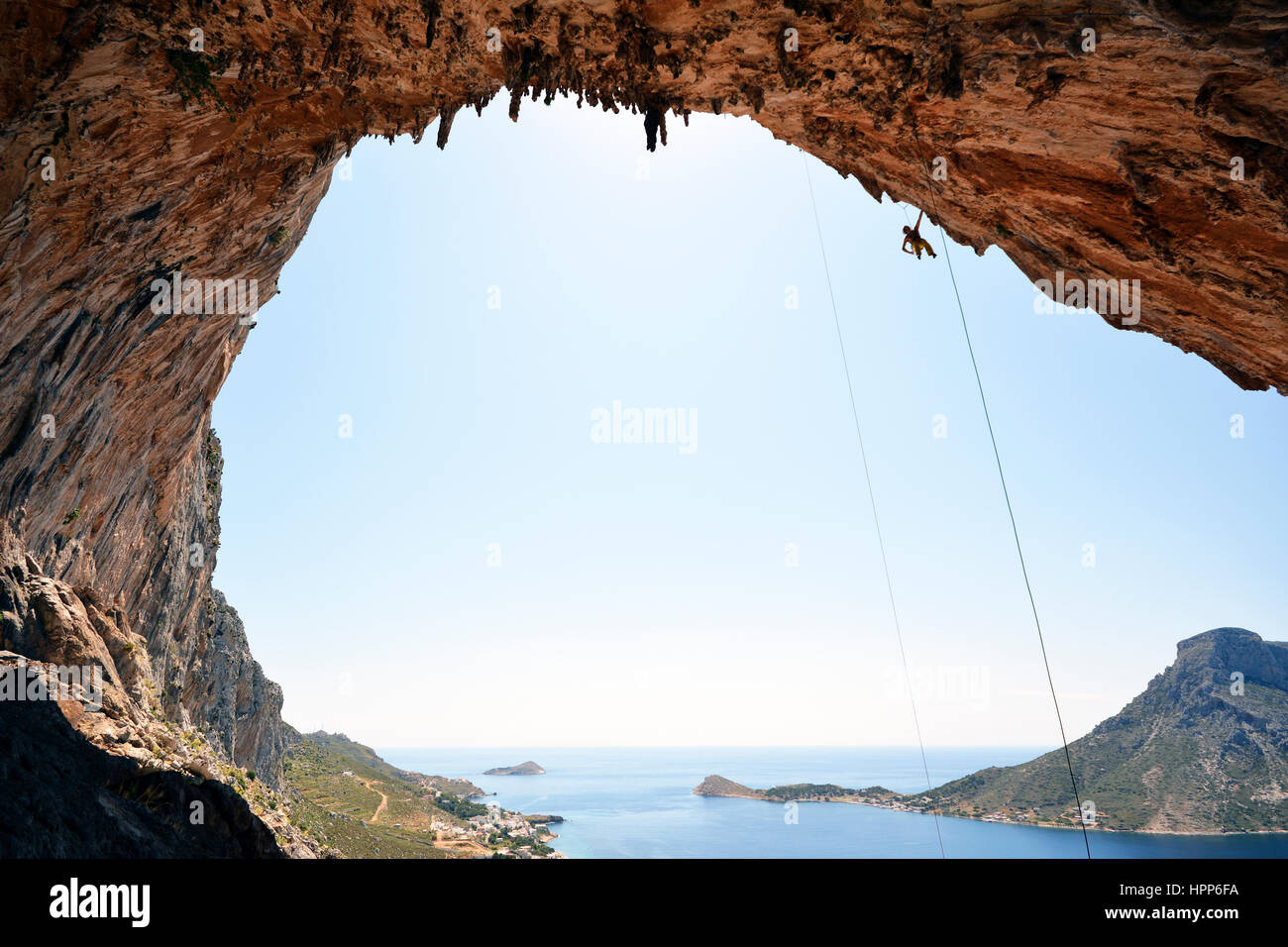 Greece, Kalymnos, climber abseiling in grotto Stock Photo - Alamy