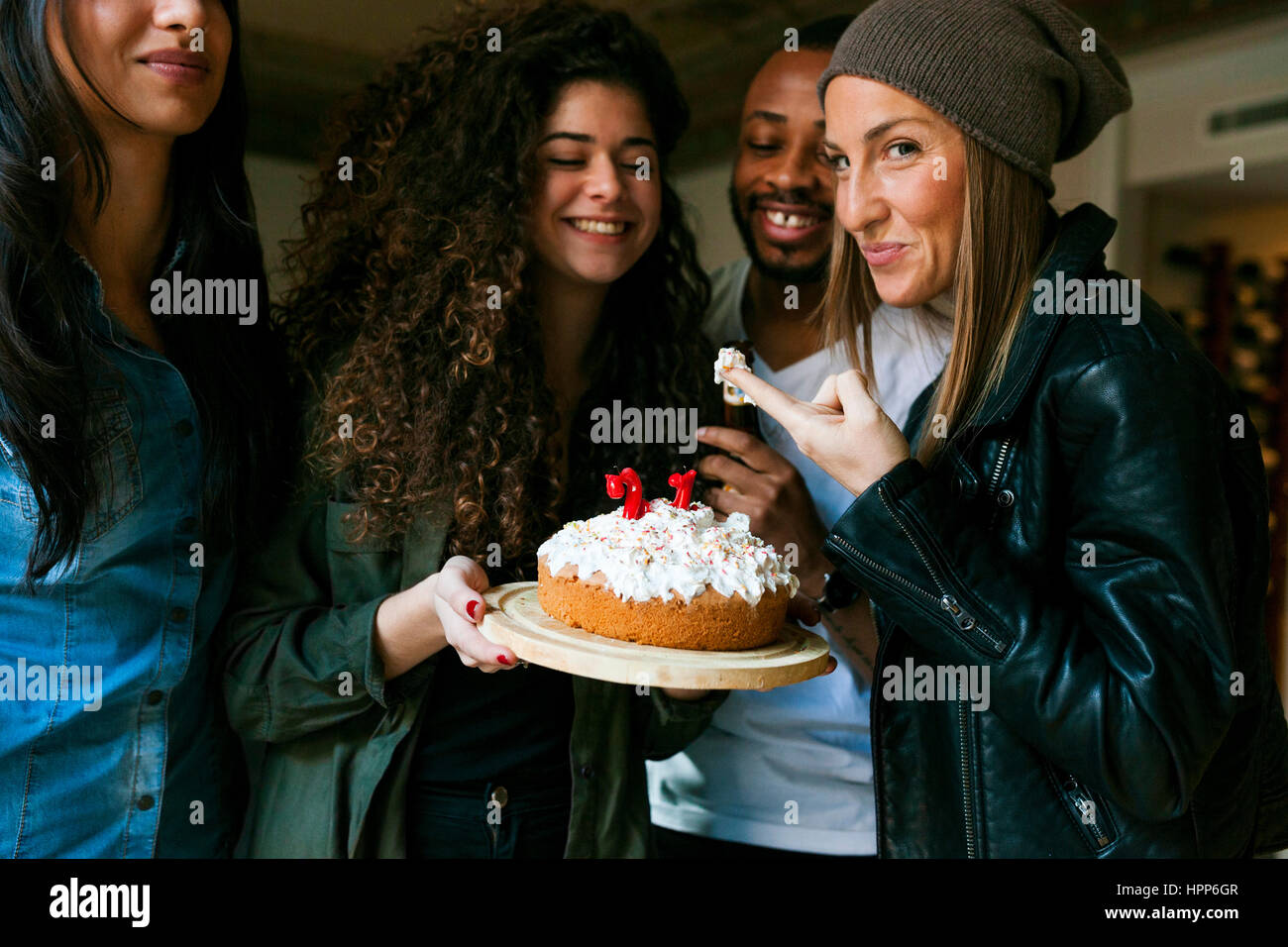 Group of young people celebrating birthday Stock Photo - Alamy