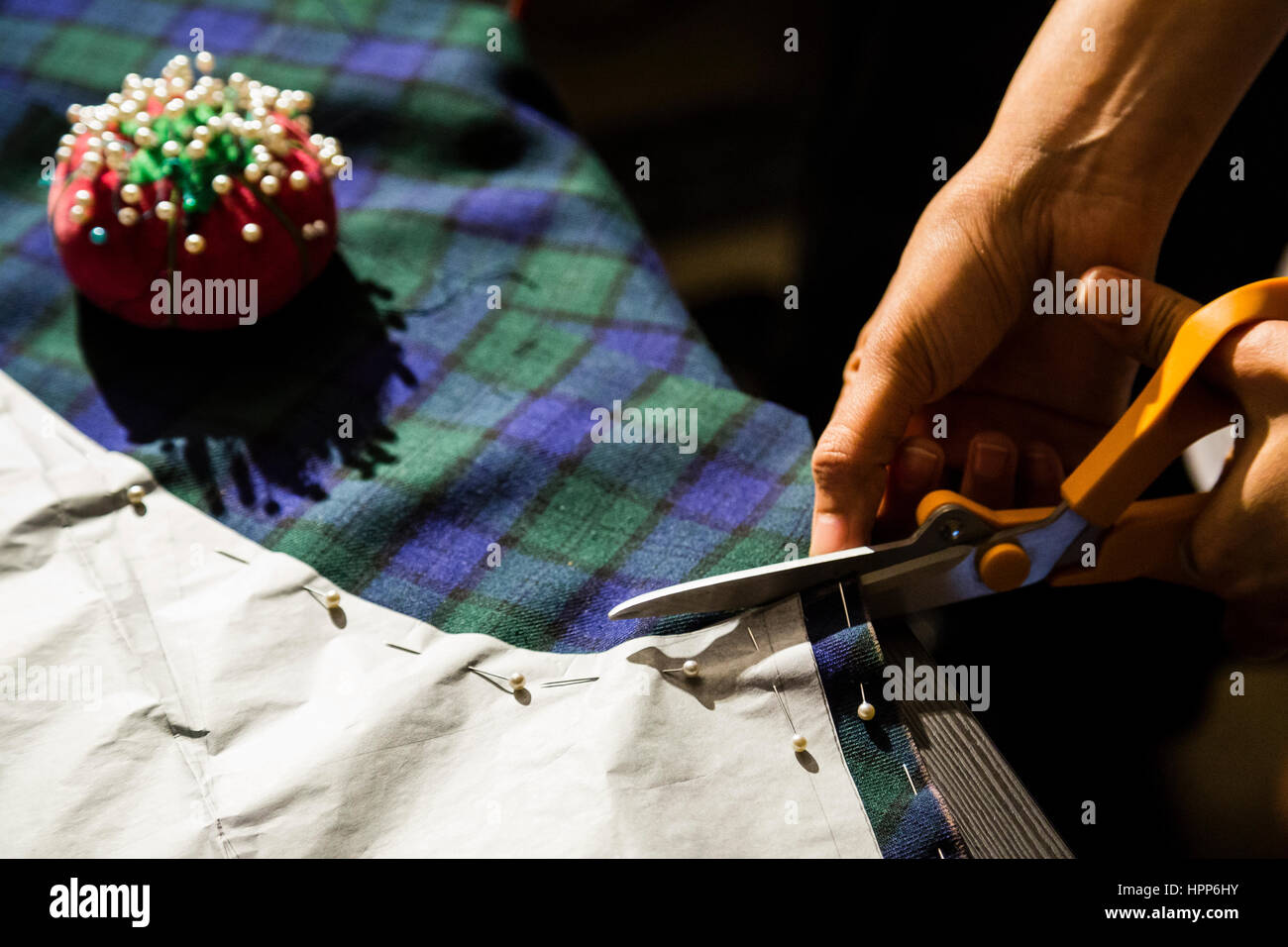 Close-up of woman sewing Stock Photo - Alamy