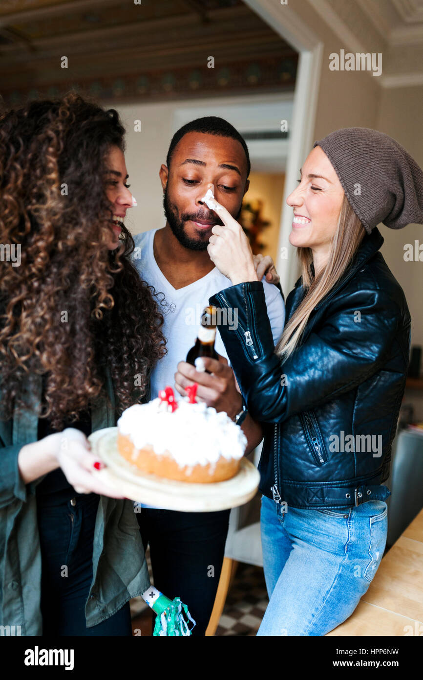 Group of young people celebrating birthday Stock Photo - Alamy