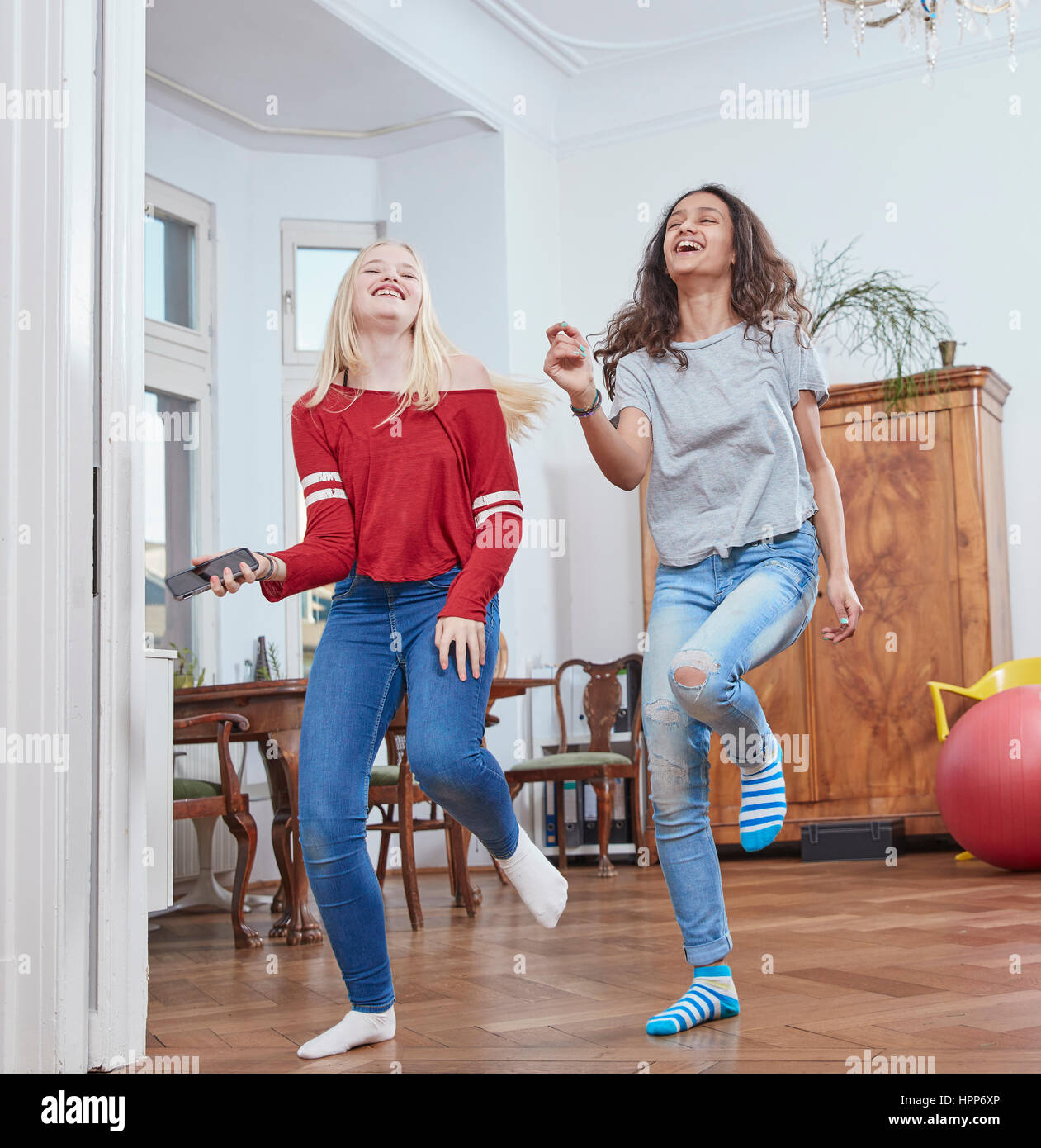Two girls dancing at home Stock Photo - Alamy