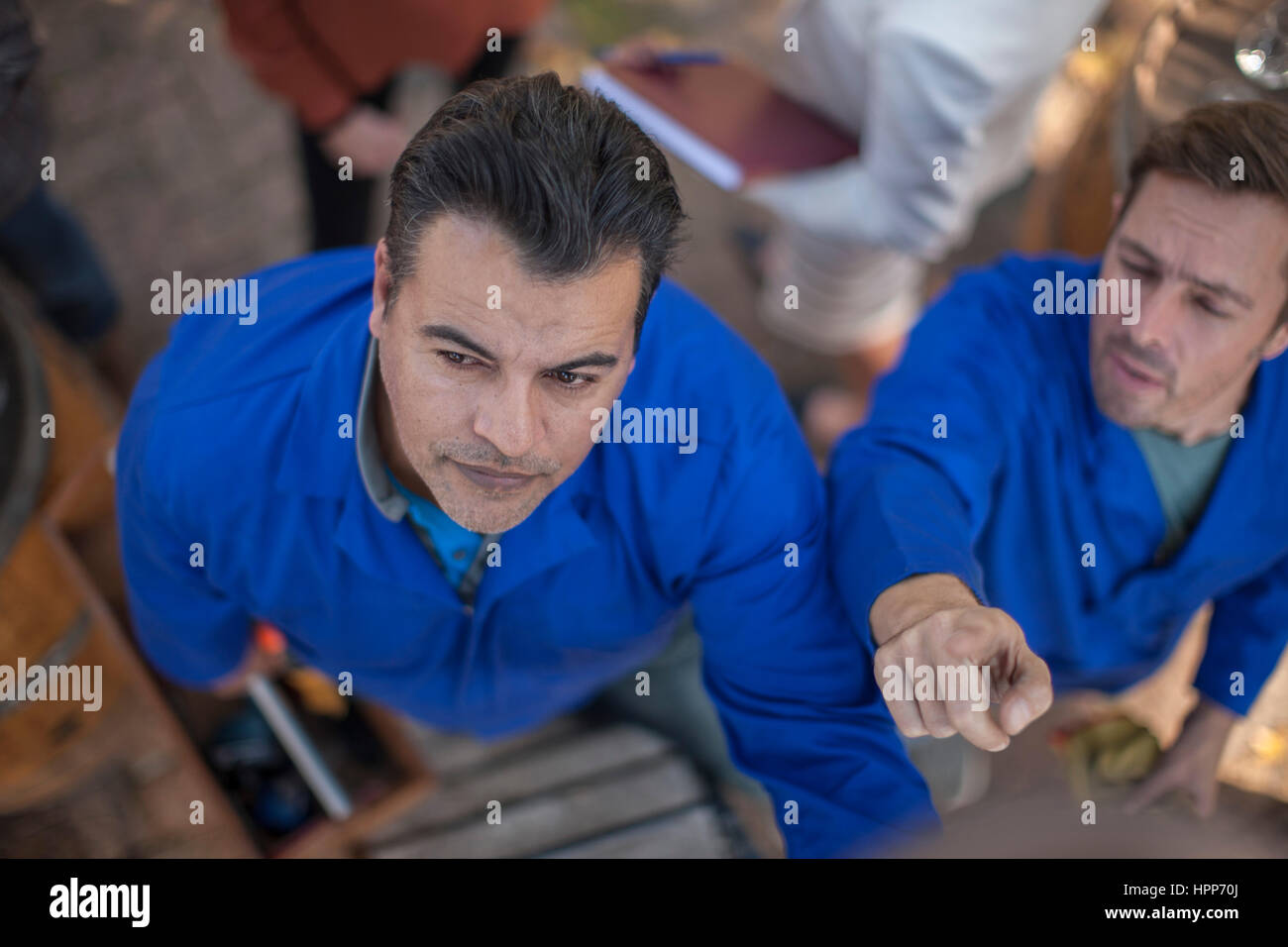 Workers at setting up wine station at event Stock Photo - Alamy