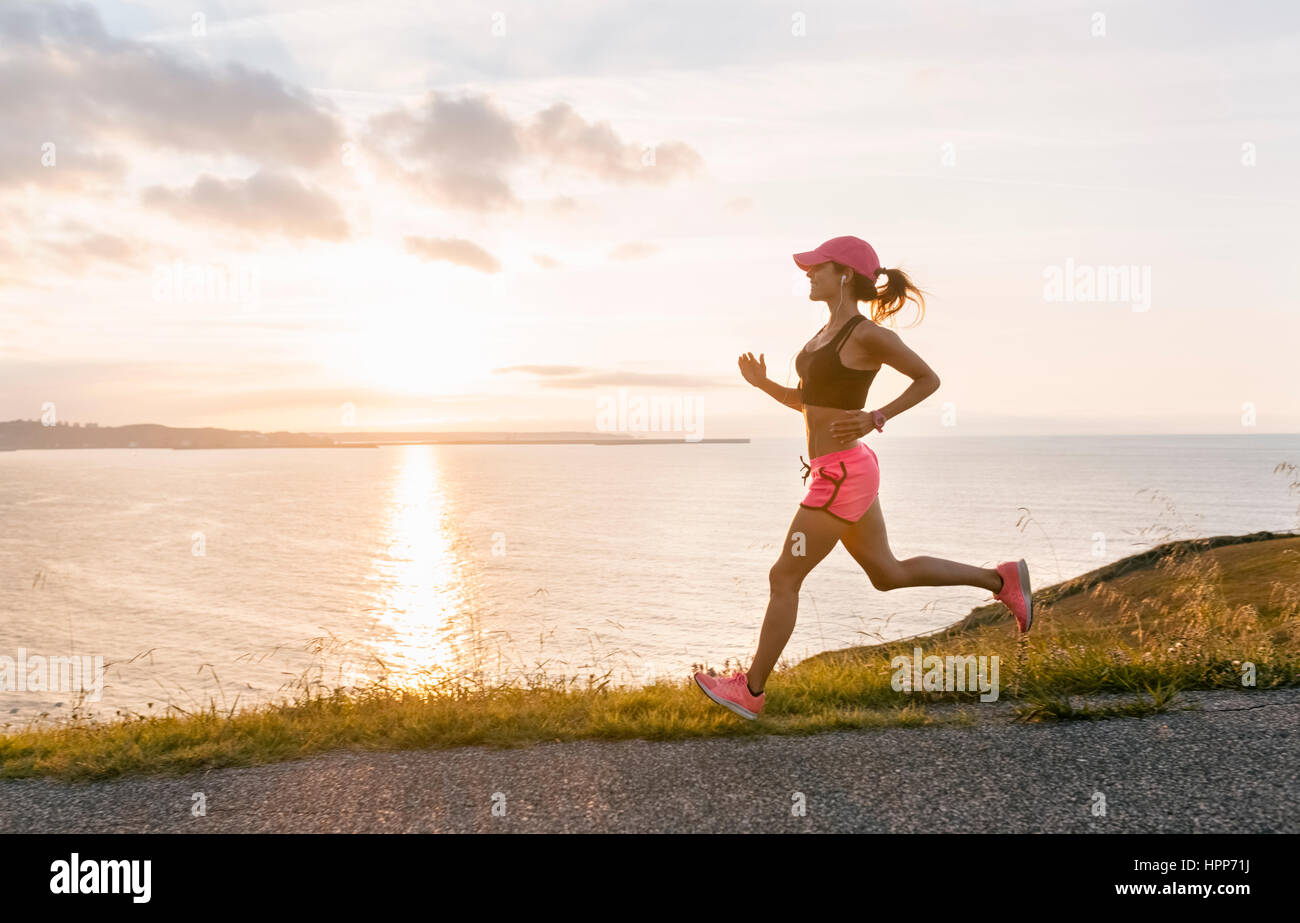 Young woman running at the sea Stock Photo - Alamy