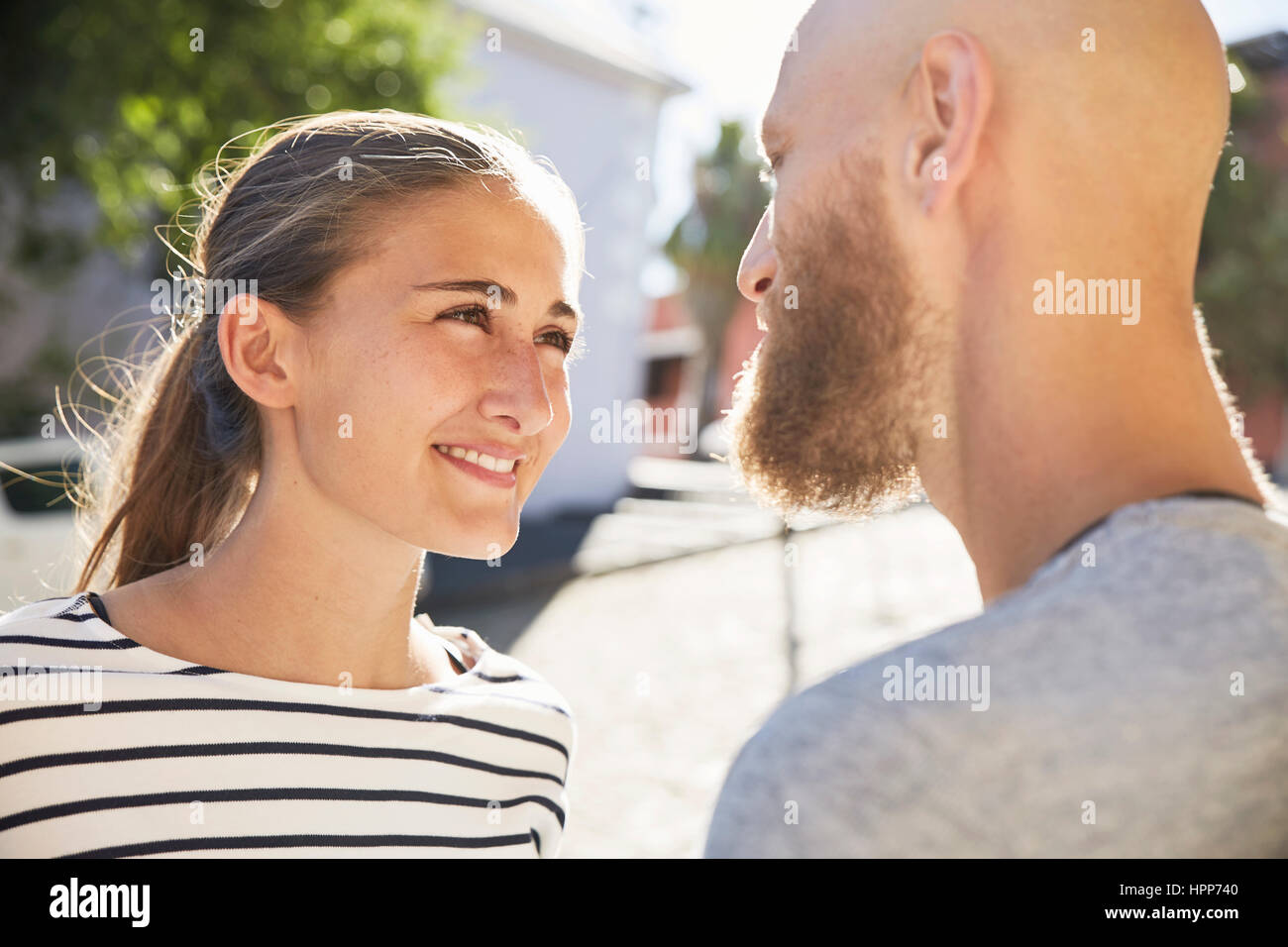Portrait of young woman face to face to her partner Stock Photo - Alamy