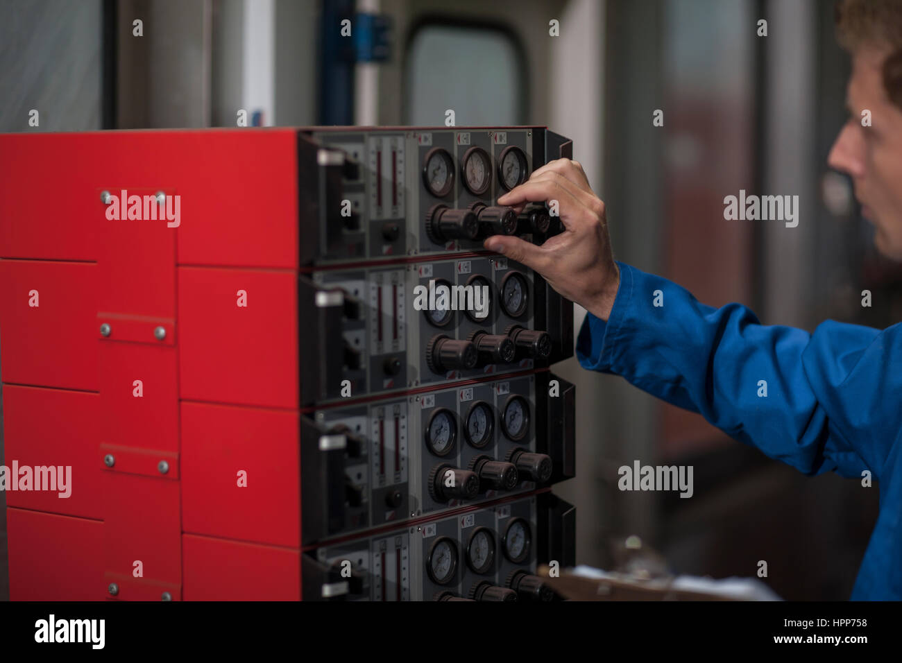 Factory worker in truck manufacture operating control panel Stock Photo ...