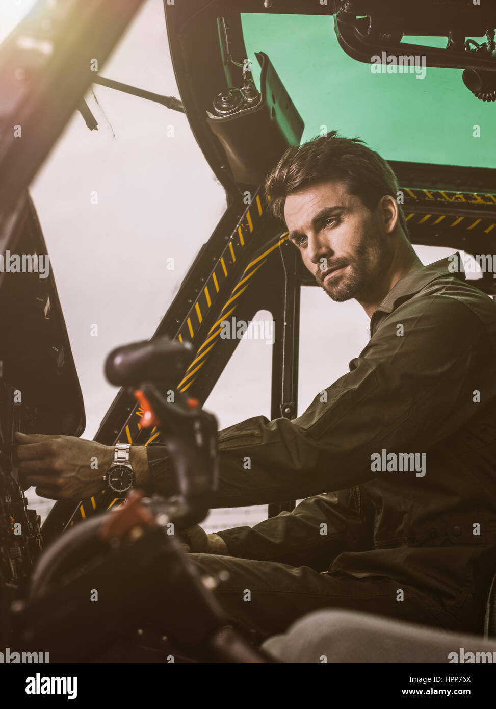 Pilot in cockpit of a helicopter Stock Photo - Alamy