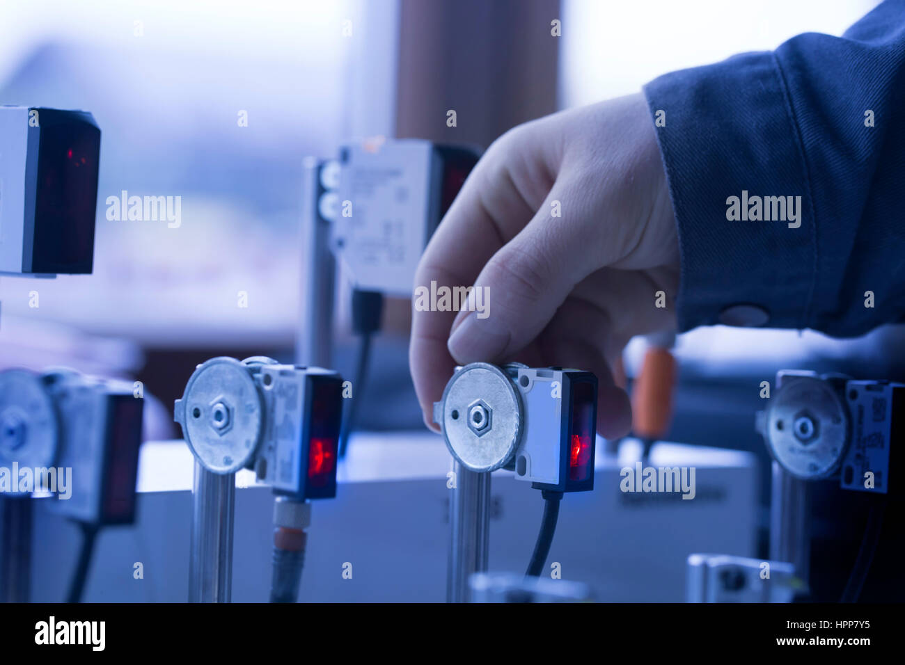 Hand operating sensoric device Stock Photo - Alamy