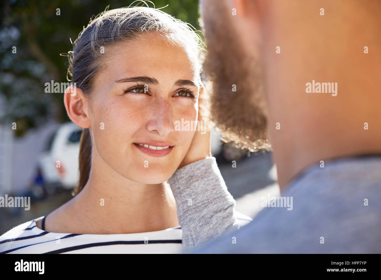Portrait of young woman face to face to her partner Stock Photo - Alamy
