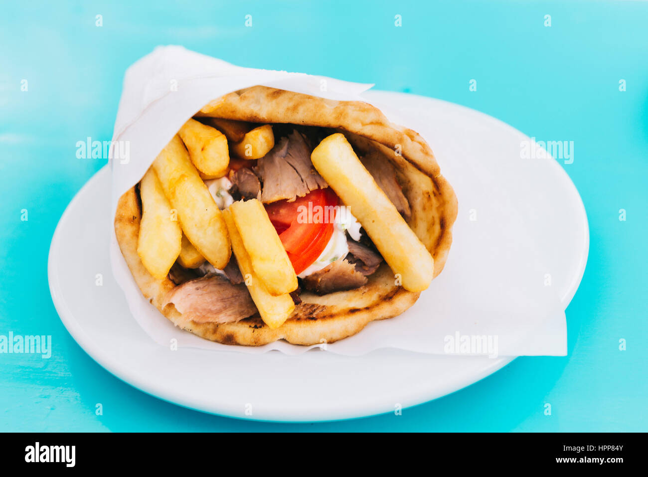 Greece, Pita bread with chicken Souvlaki, French fries and Tzatziki ...