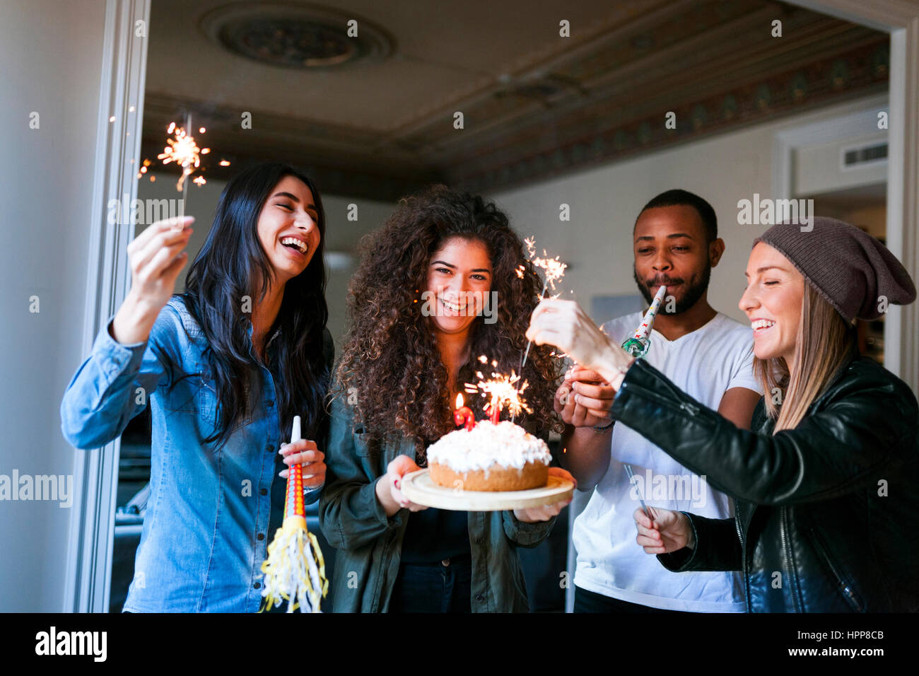 Group of young people celebrating birthday Stock Photo - Alamy