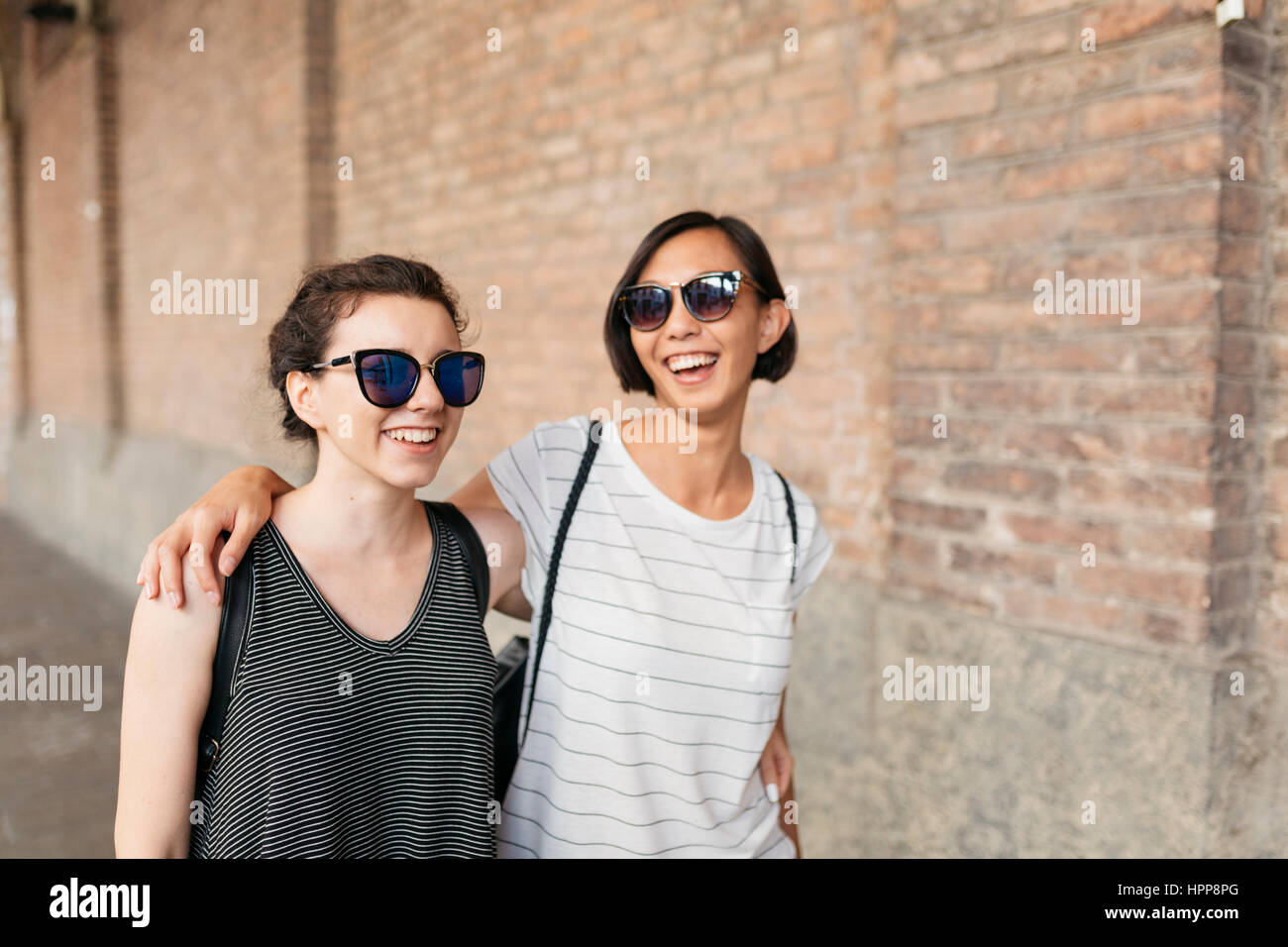 Portrait of two best friends with sunglasses having fun Stock Photo - Alamy