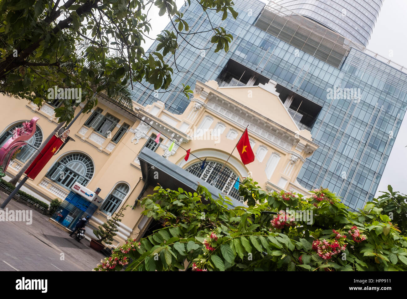 Colonial style building in front of modern glass tower, Ho Chi Minh ...