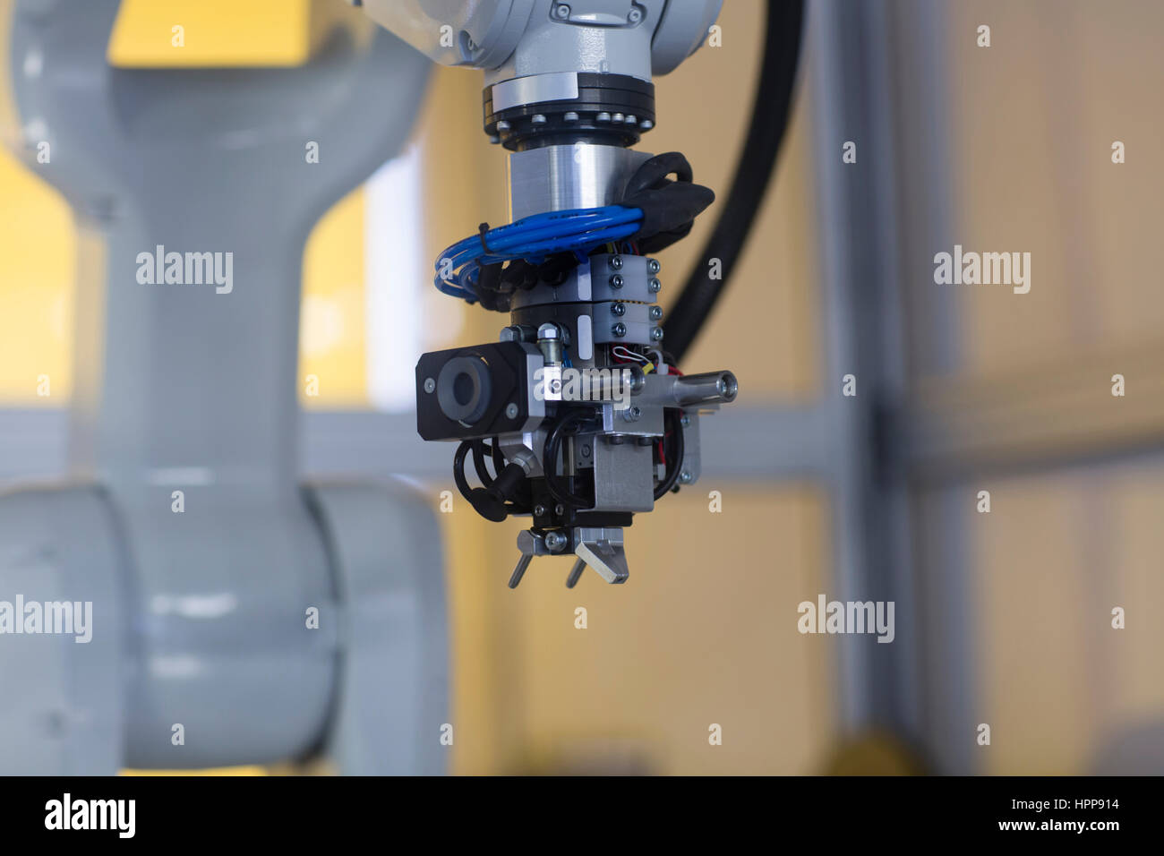 Robot arm in a sensor technology plant Stock Photo - Alamy