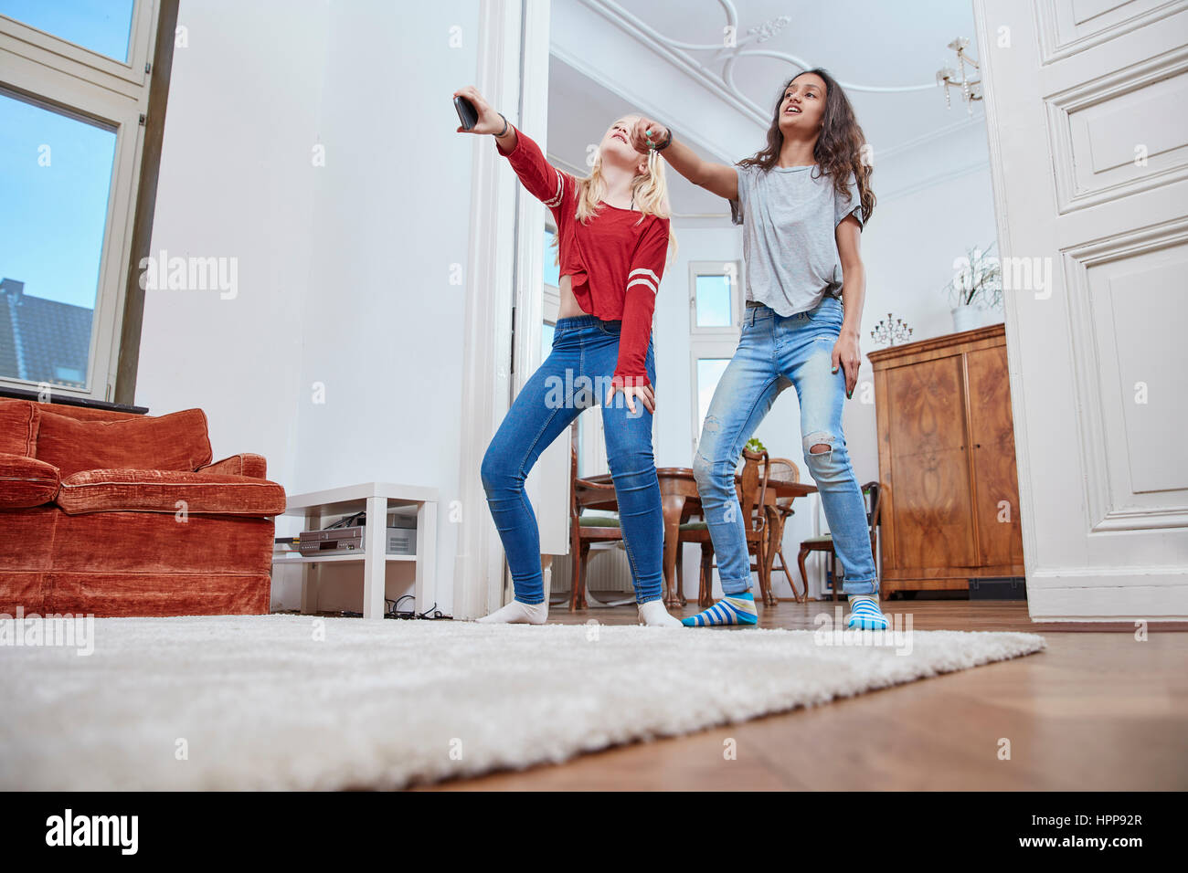 Two girls dancing at home Stock Photo - Alamy