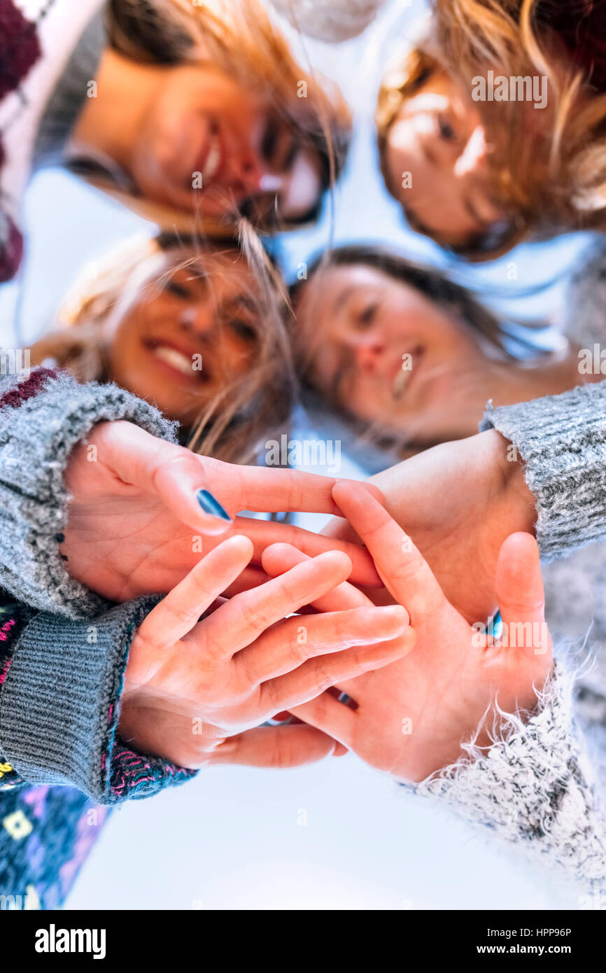 Four Friends Joining Hands High Resolution Stock Photography and Images ...