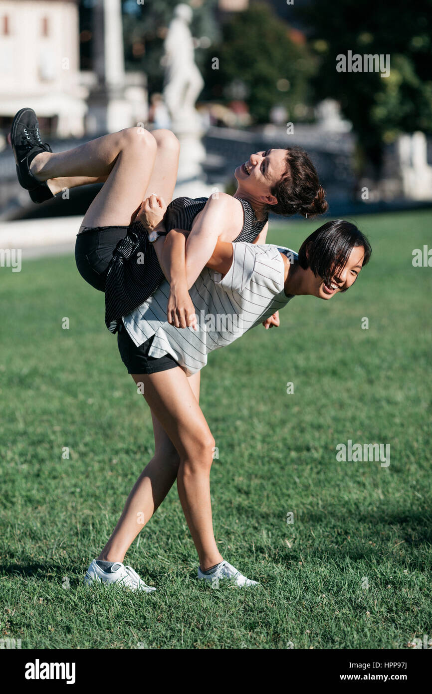Two best friends having fun together in the park Stock Photo - Alamy