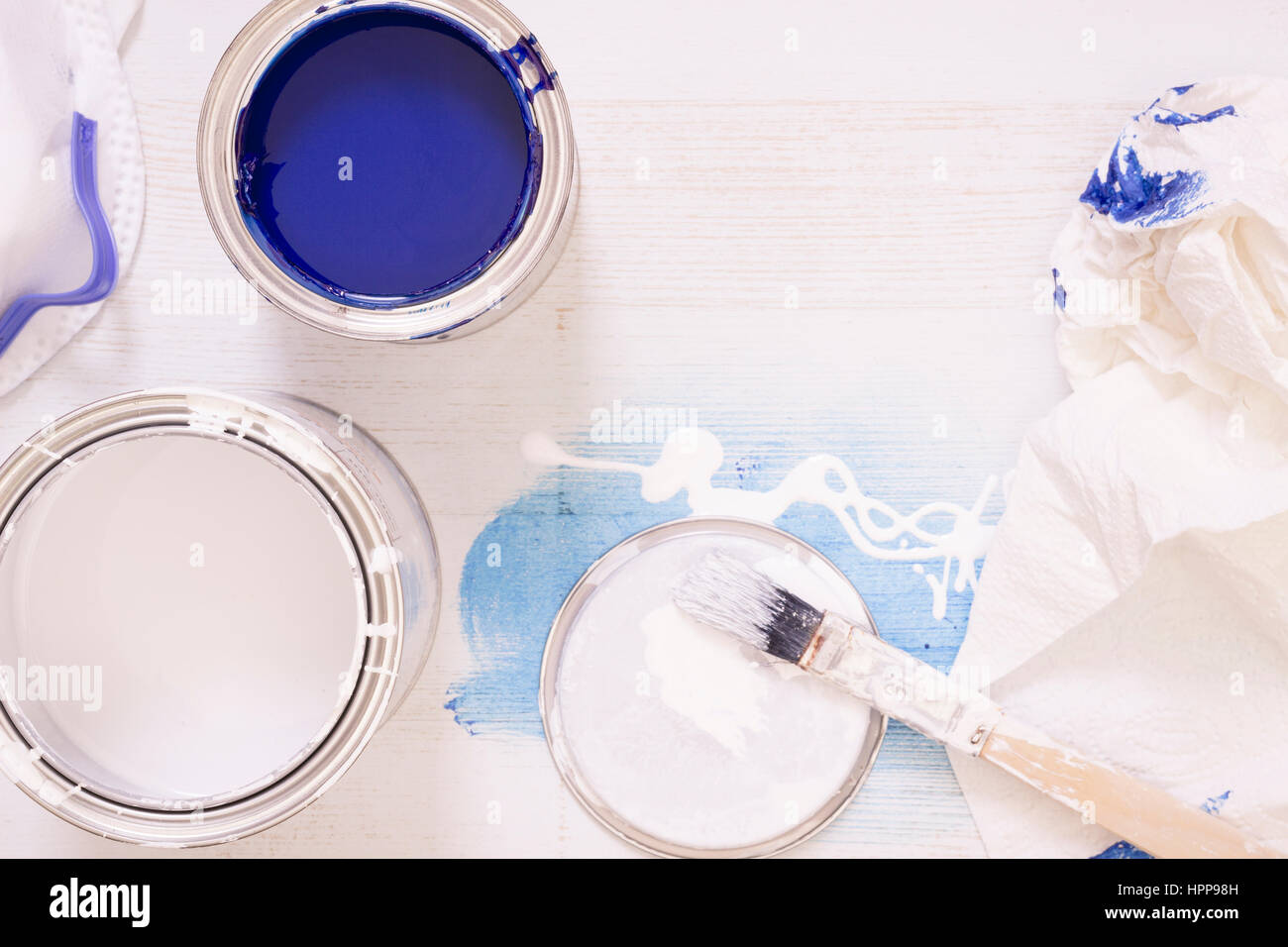 Used paint brush and paint tins with blue and white varnish Stock Photo ...