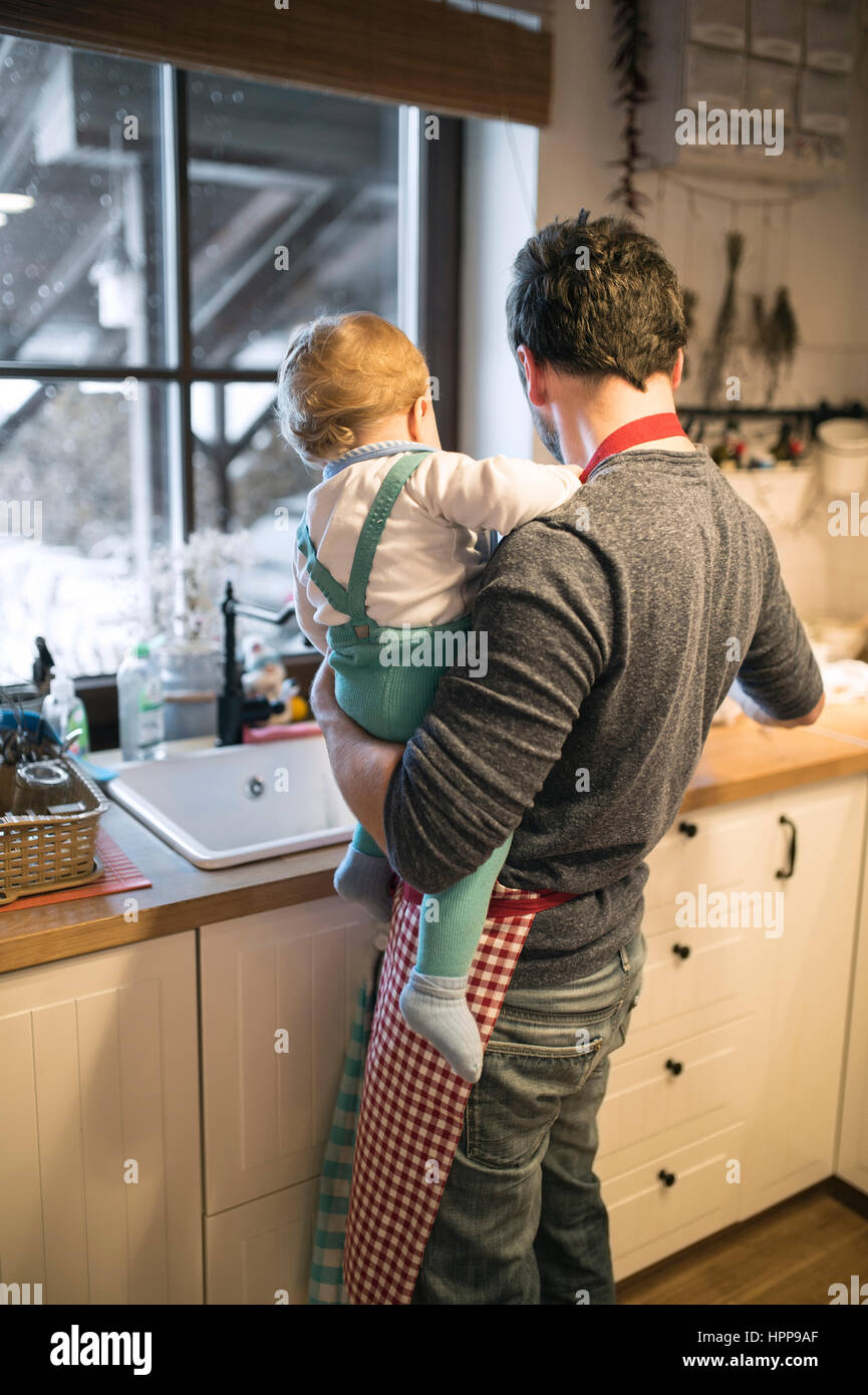 Father and son washing dishes hi-res stock photography and images - Alamy
