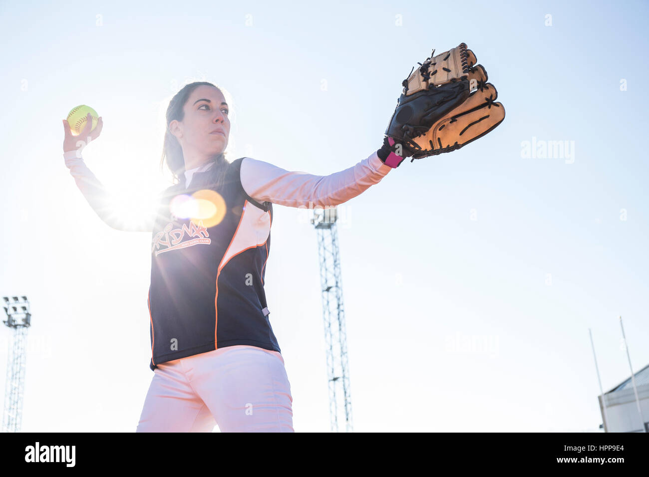 Female pitcher ready to throw the ball during a baseball game Stock ...