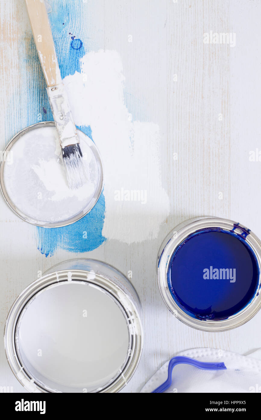 Used paint brush and paint tins with blue and white varnish Stock Photo ...
