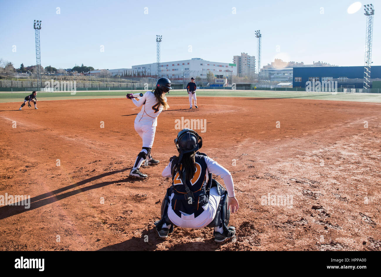 Female batter hitting the ball during a baseball game Stock Photo - Alamy