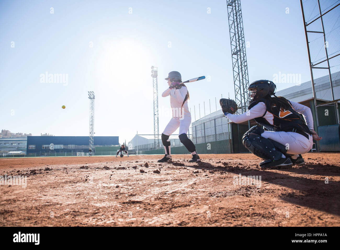 Female batter hitting the ball during a baseball game Stock Photo - Alamy